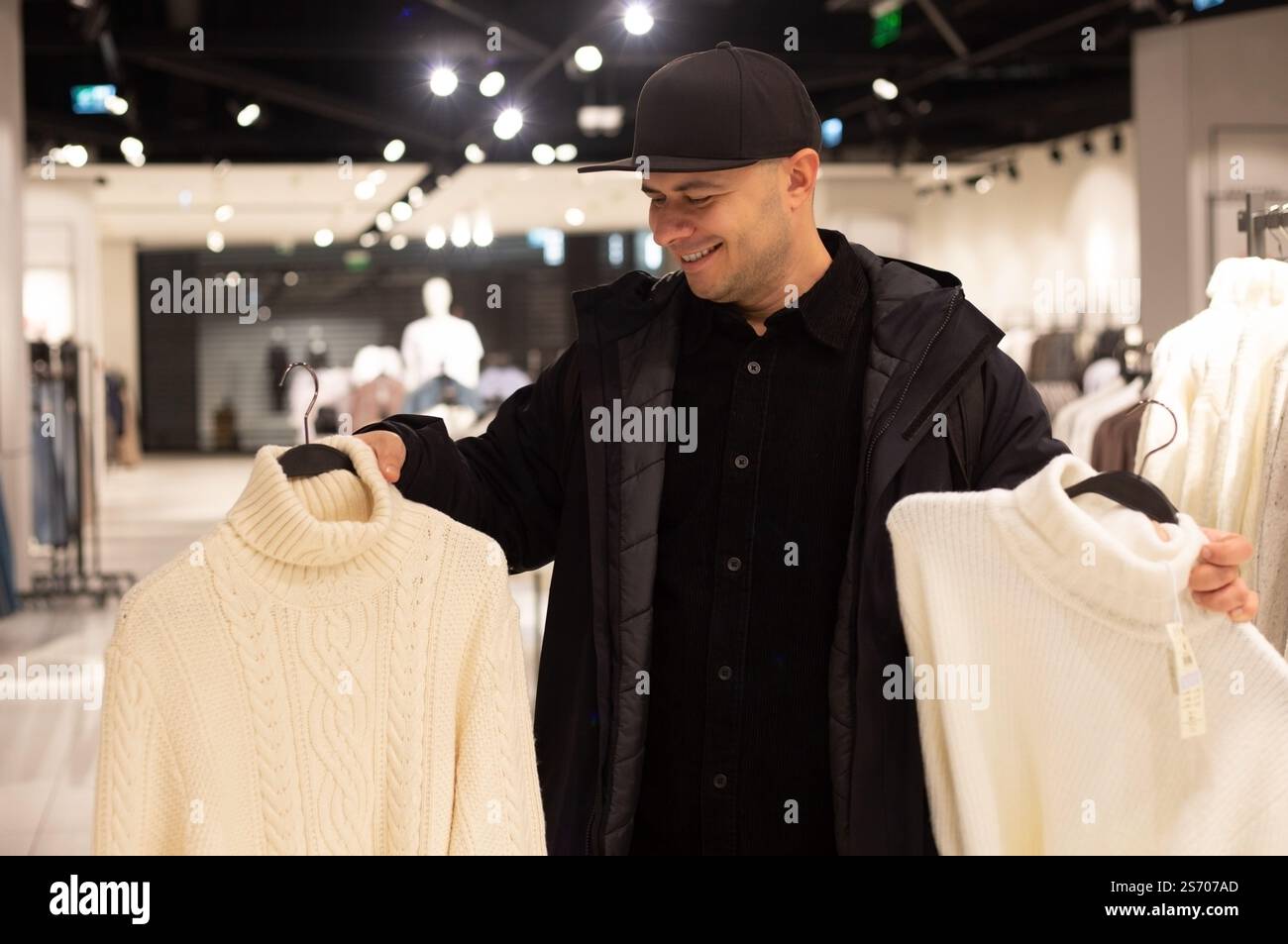 man in clothing store Stock Photo - Alamy