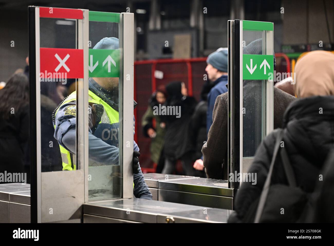 Stockholm, Uppland, Sweden. January 1 2025. Police and security guards ...