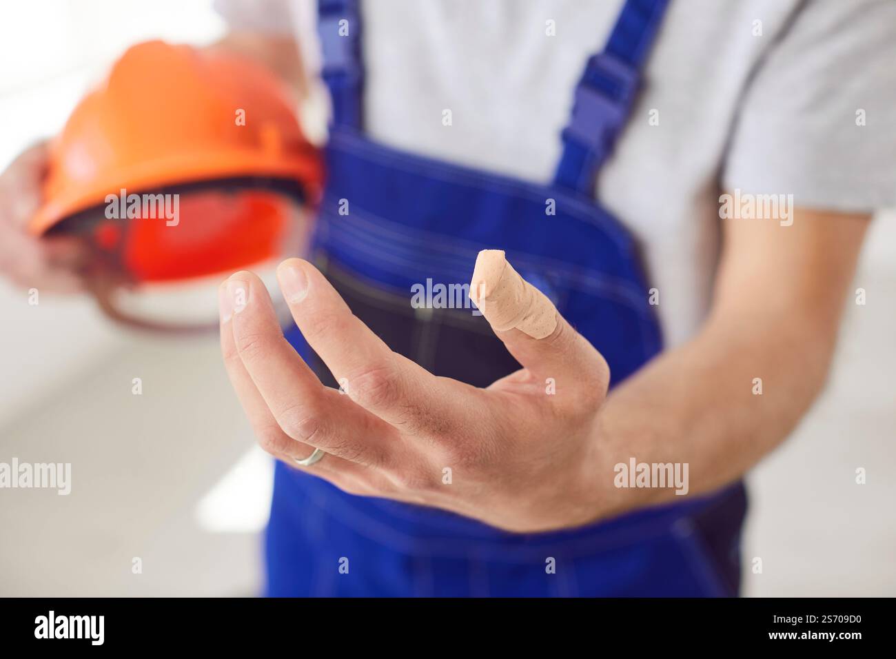 Close up of male worker suffering after job accident showing hand with ...