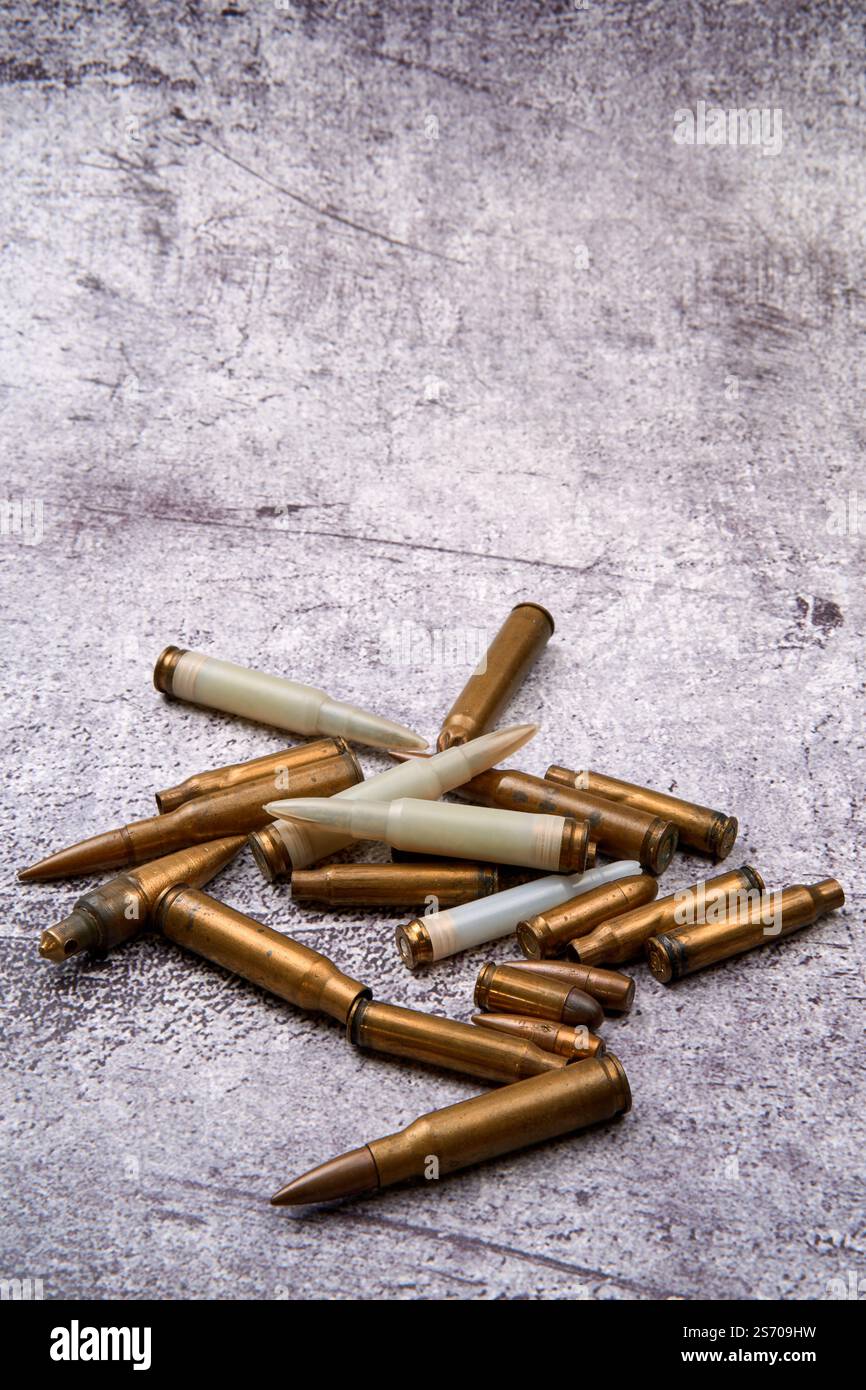 Composition of rounds of ammunition on floor Stock Photo - Alamy
