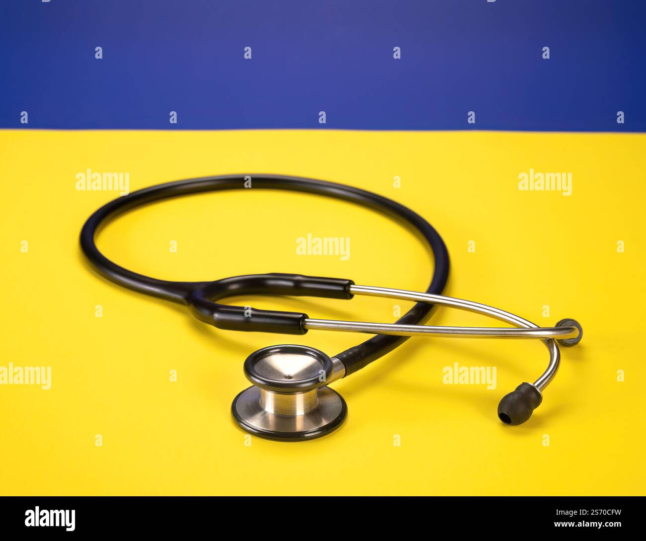 A stethoscope displayed on a colorful backdrop representing healthcare ...