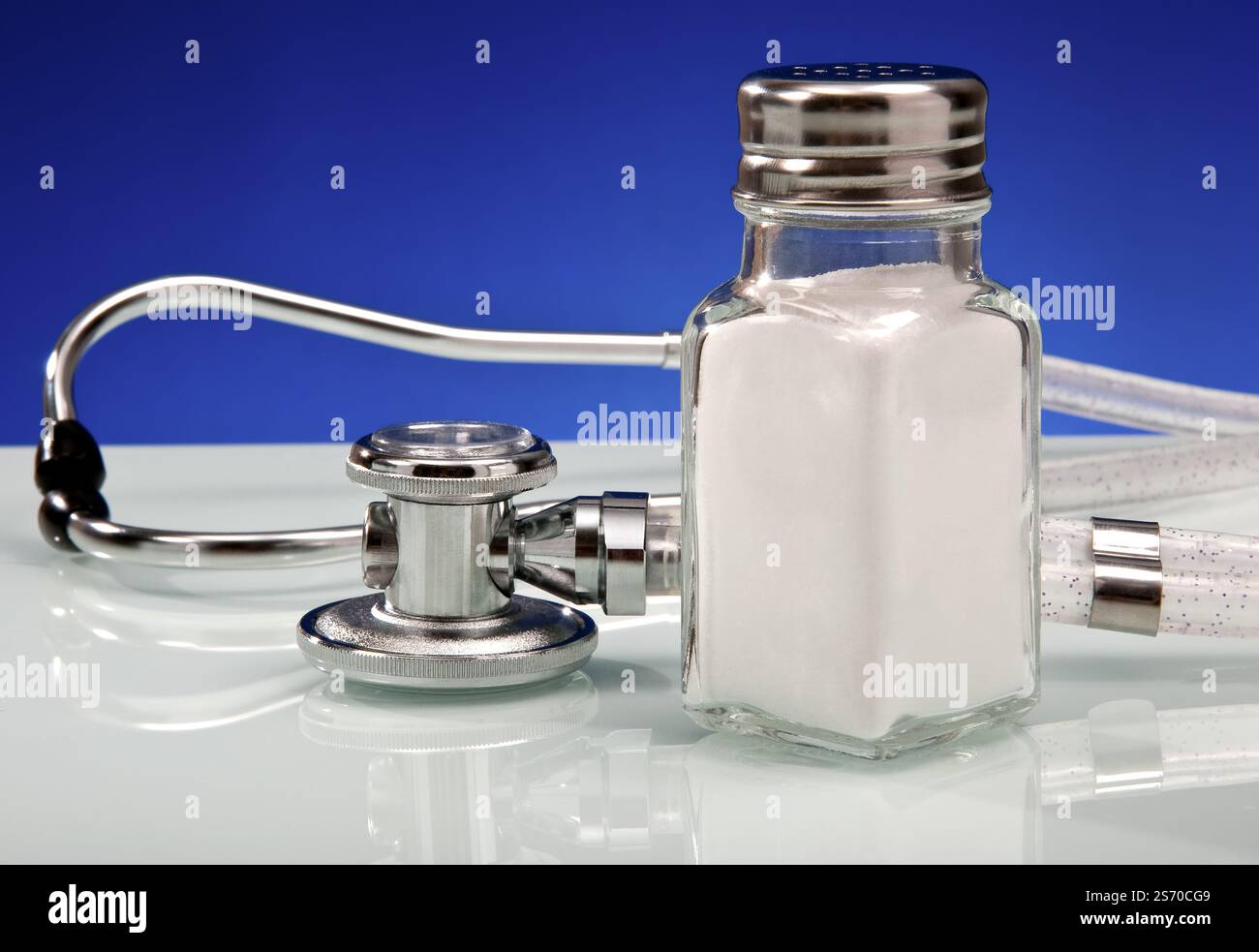 Salt shaker alongside stethoscope demonstrating concept of sodium ...