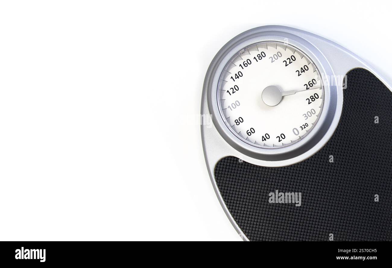 Mechanical weight scale close-up with graduated dial for weight ...