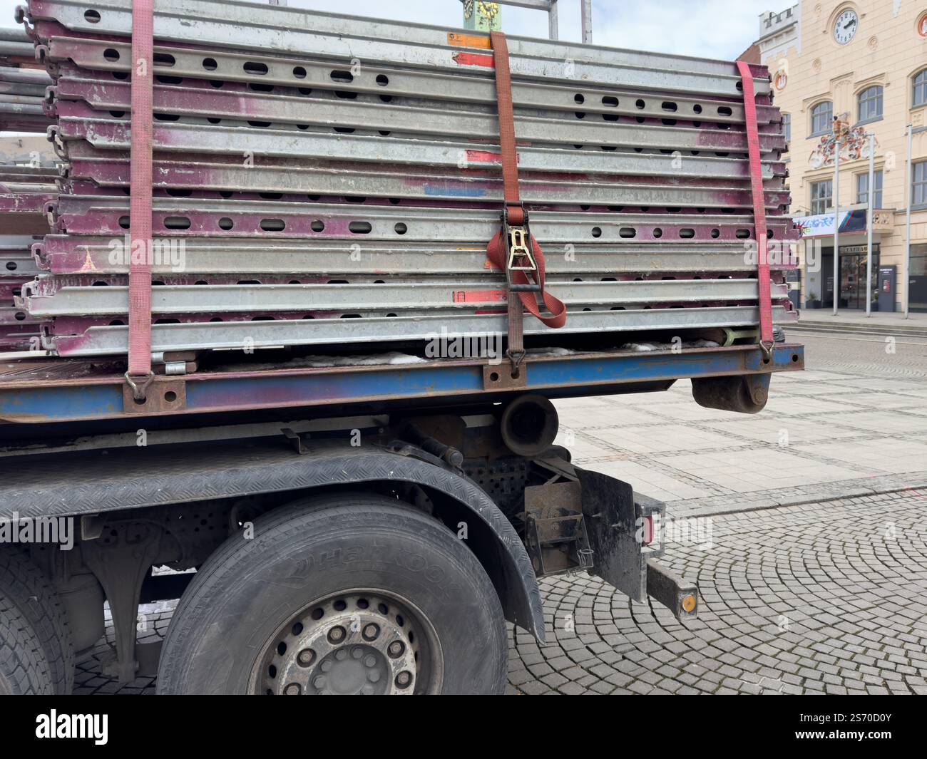 Securing the load on the truck with a tension strap Stock Photo - Alamy