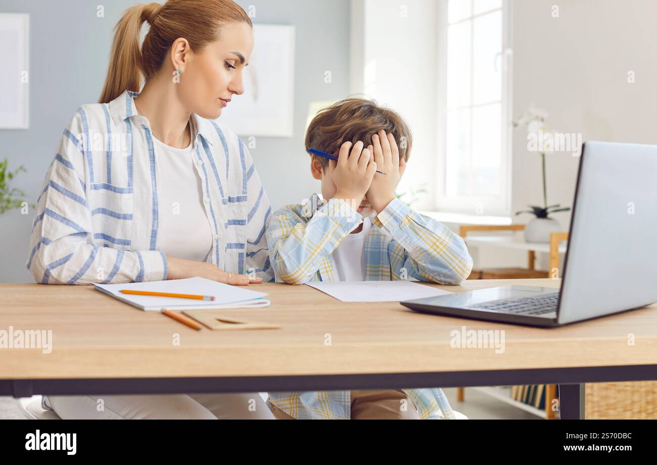 Caring Mother Supporting Sad And Crying Son Doing Homework Stock Photo ...