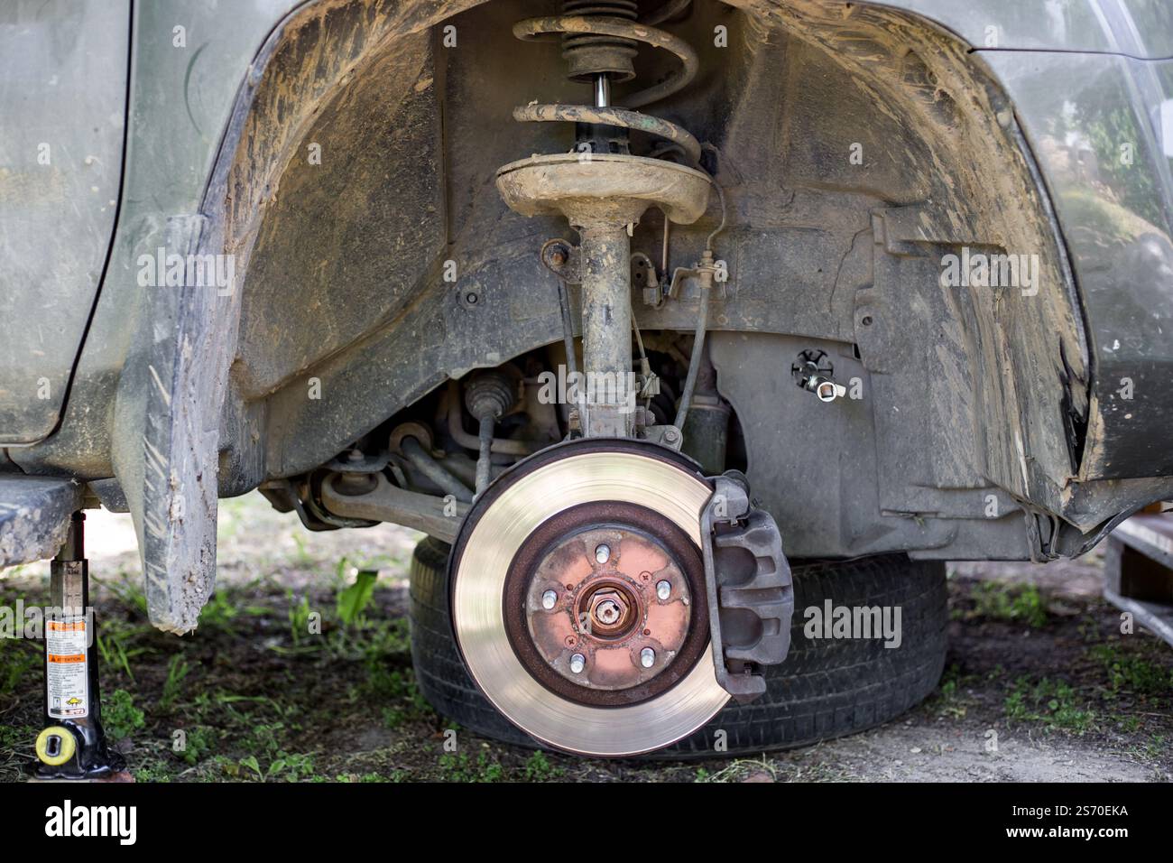 Repair of the car brake system. Removing the wheel to access the brake ...
