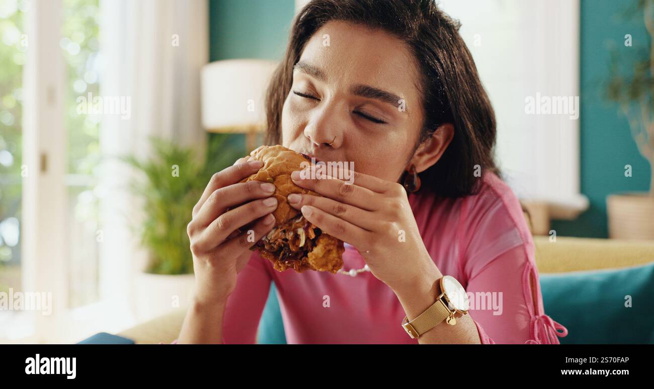 Home, hamburger and hungry woman eating fast food, unhealthy and ...