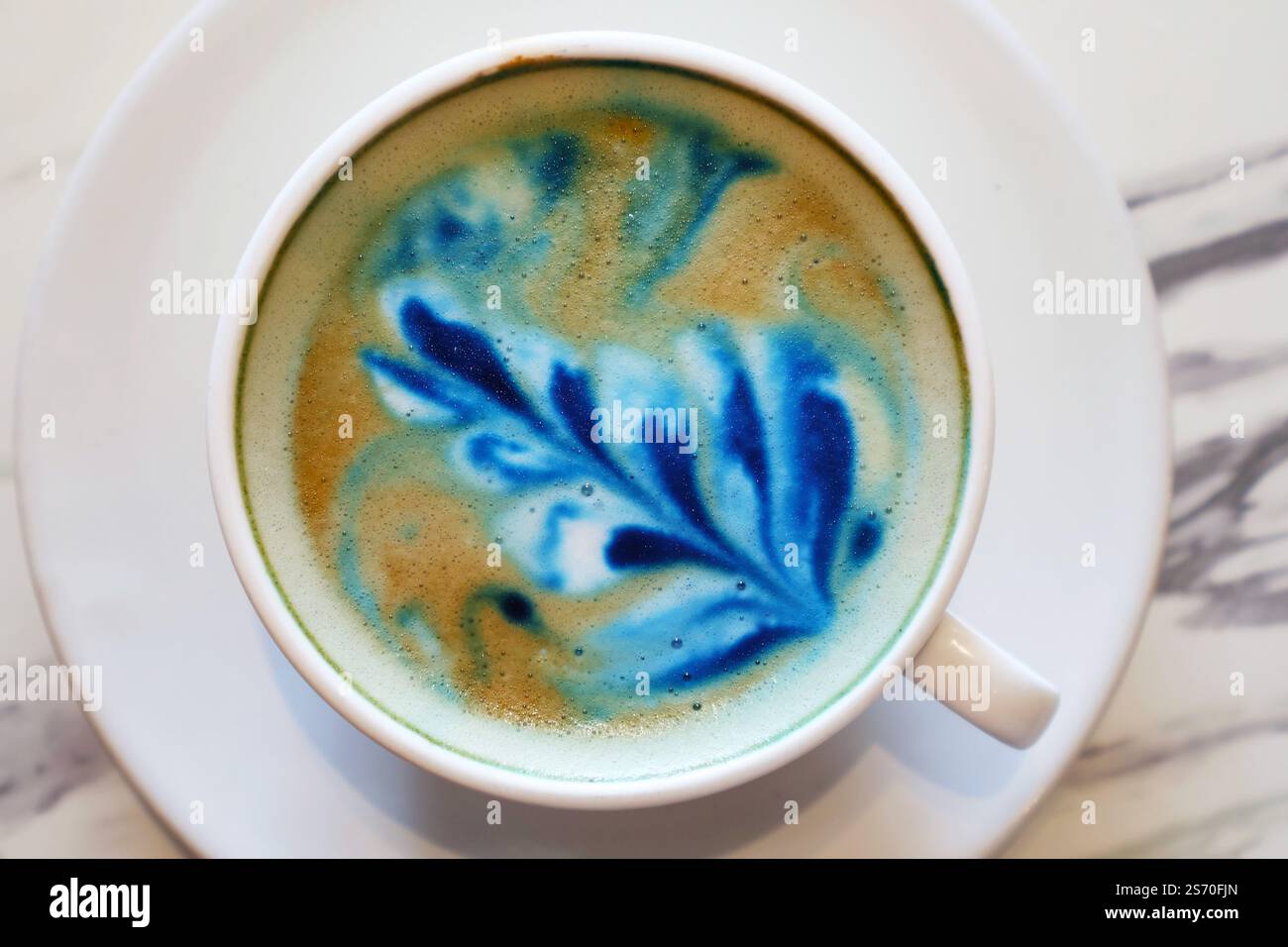 Mouthwatering cappuccino coffee with blue butterfly pea latte art Stock ...