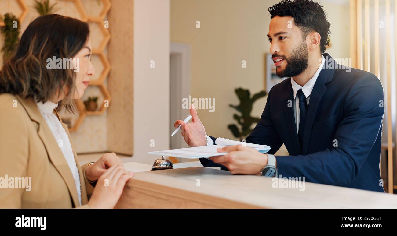Hotel reception, info and woman at desk with man, paperwork and ...