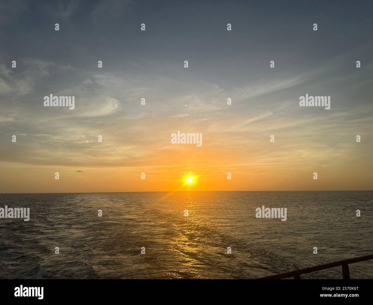 Ship carrying cargo by the sea Stock Photo - Alamy