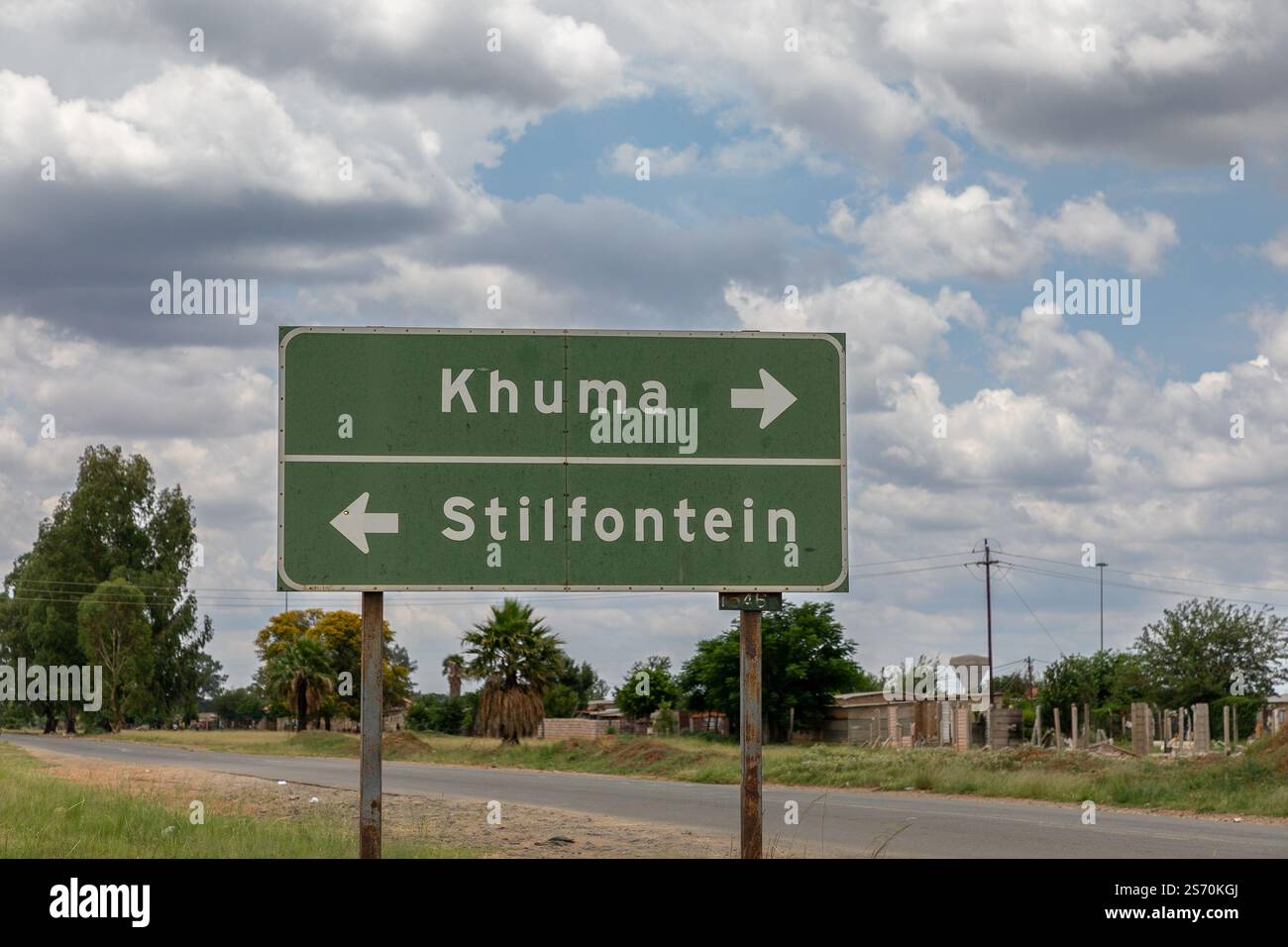 Road sign reading Khuma and Stilfontein in left and right directions ...
