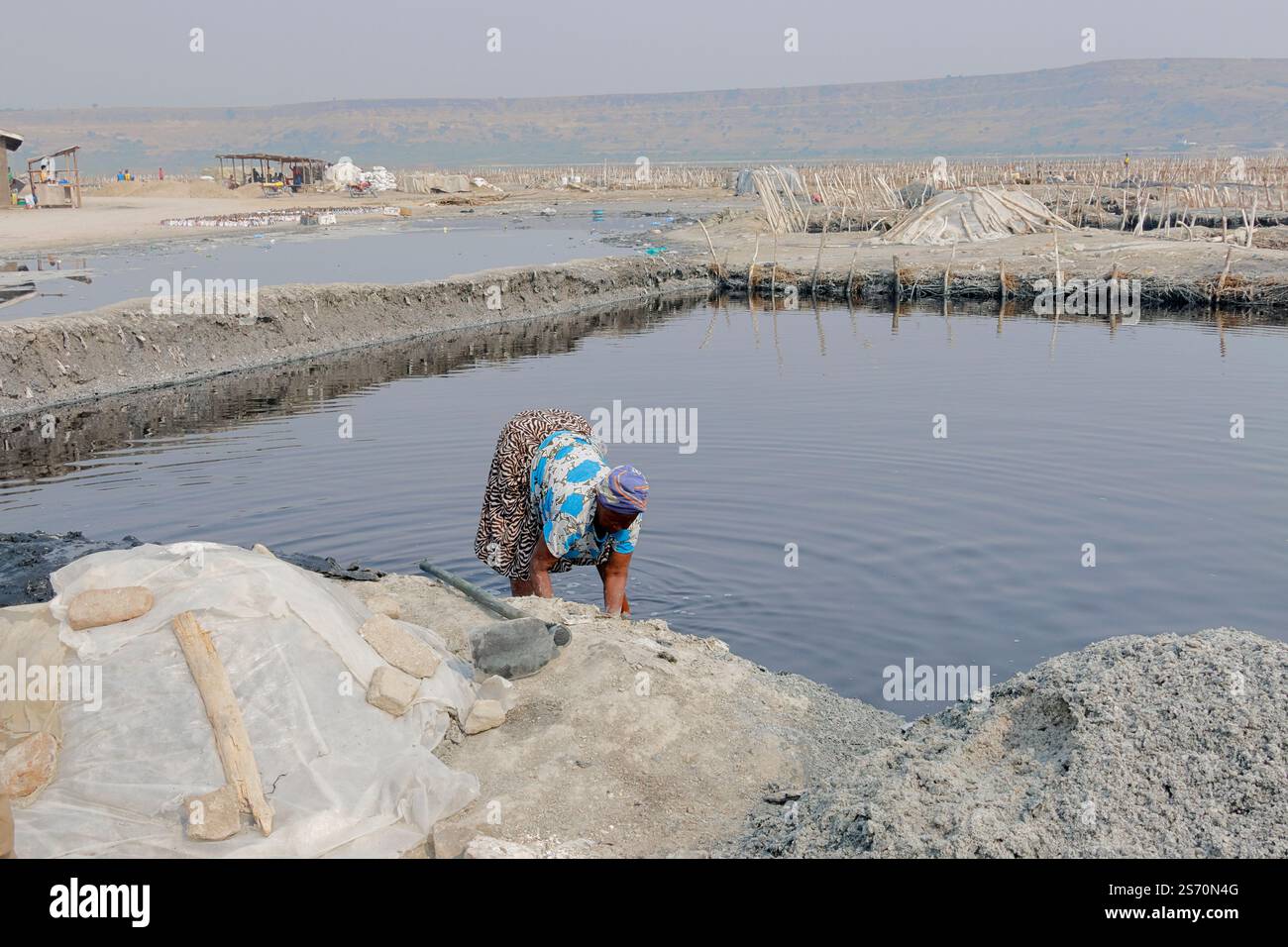 A local tribeswoman Salt mining in Lake Katwe Queen Elizabeth national park, Uganda, Africa ...