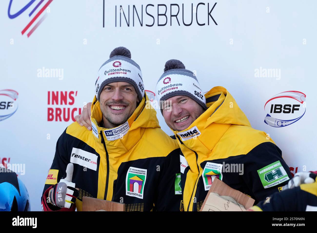 Johannes Lochner and Georg Fleischhauer, of Germany, pose on the podium ...