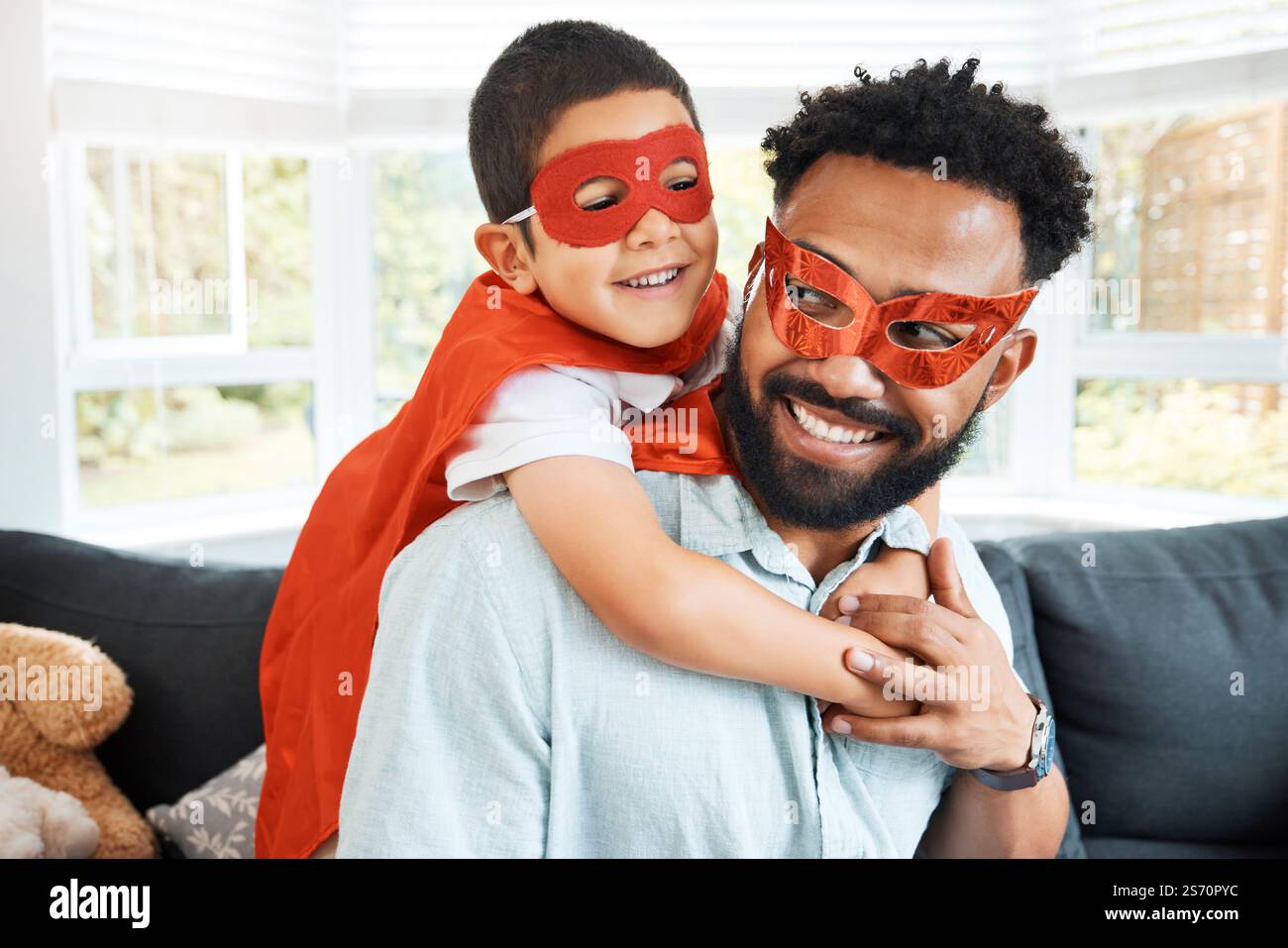 Father, child and superhero costume in home, hug son and playing ...