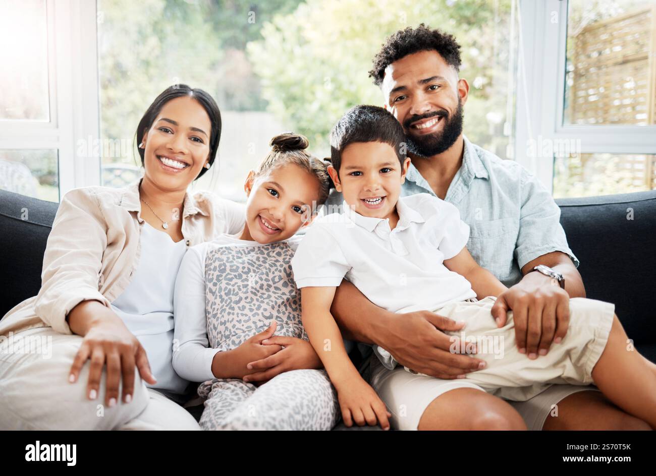 Love, parents and children with portrait on sofa for relax, bonding ...