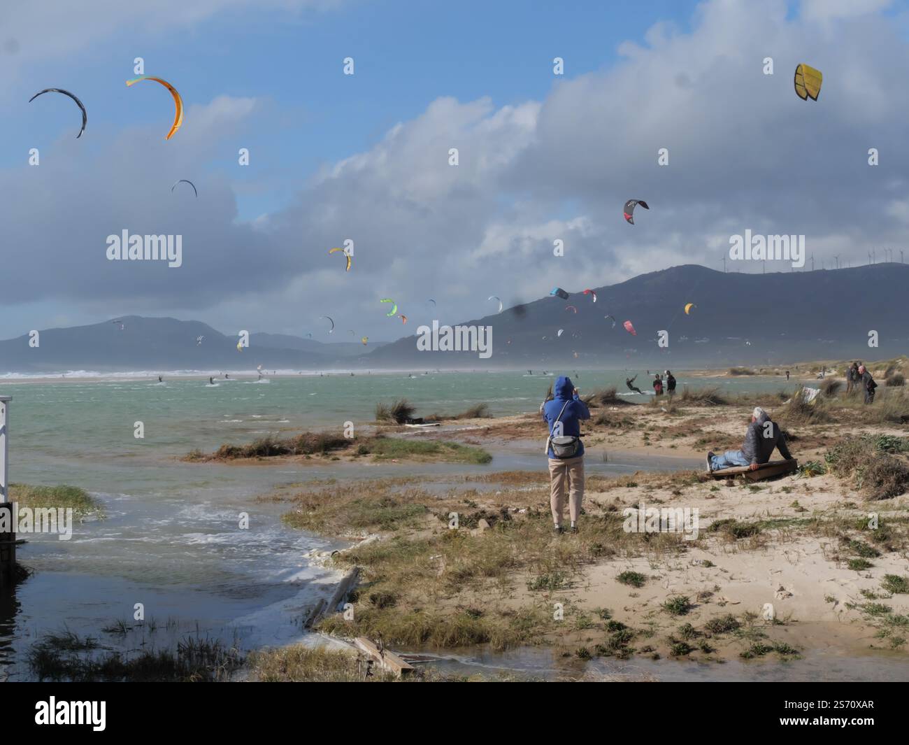 Windsurfer in the Atlantic in front of the sandy beach near Tarifa ...
