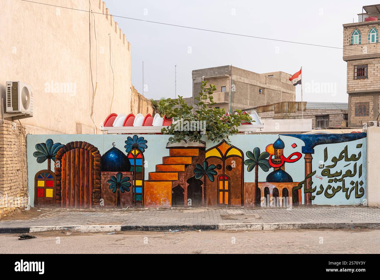 Colorful wall painting around side of street in Basrah, Iraq Stock ...