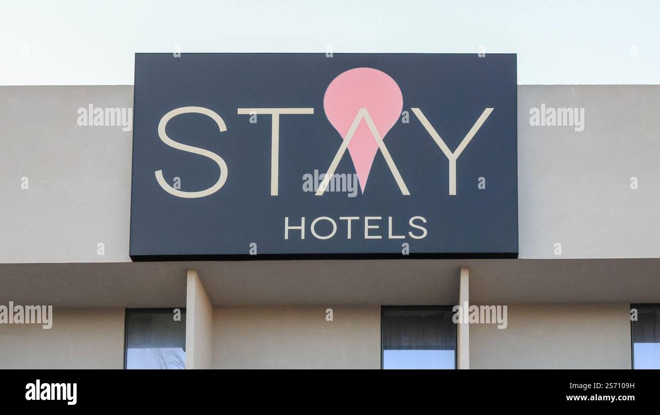 Close up of stay hotels logo displayed on a building, representing ...