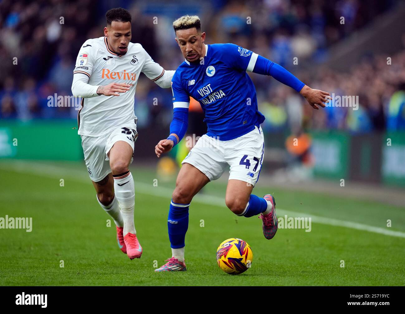 Cardiff City's Callum Robinson gets away from Swansea City's Martins ...