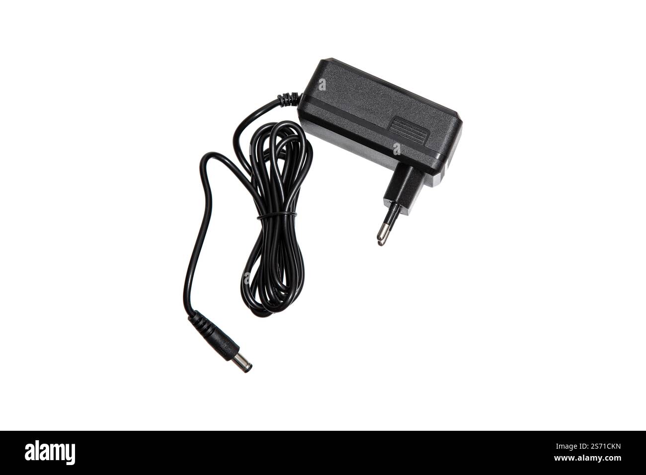 A black power adapter with a coiled cable, isolated on a white ...