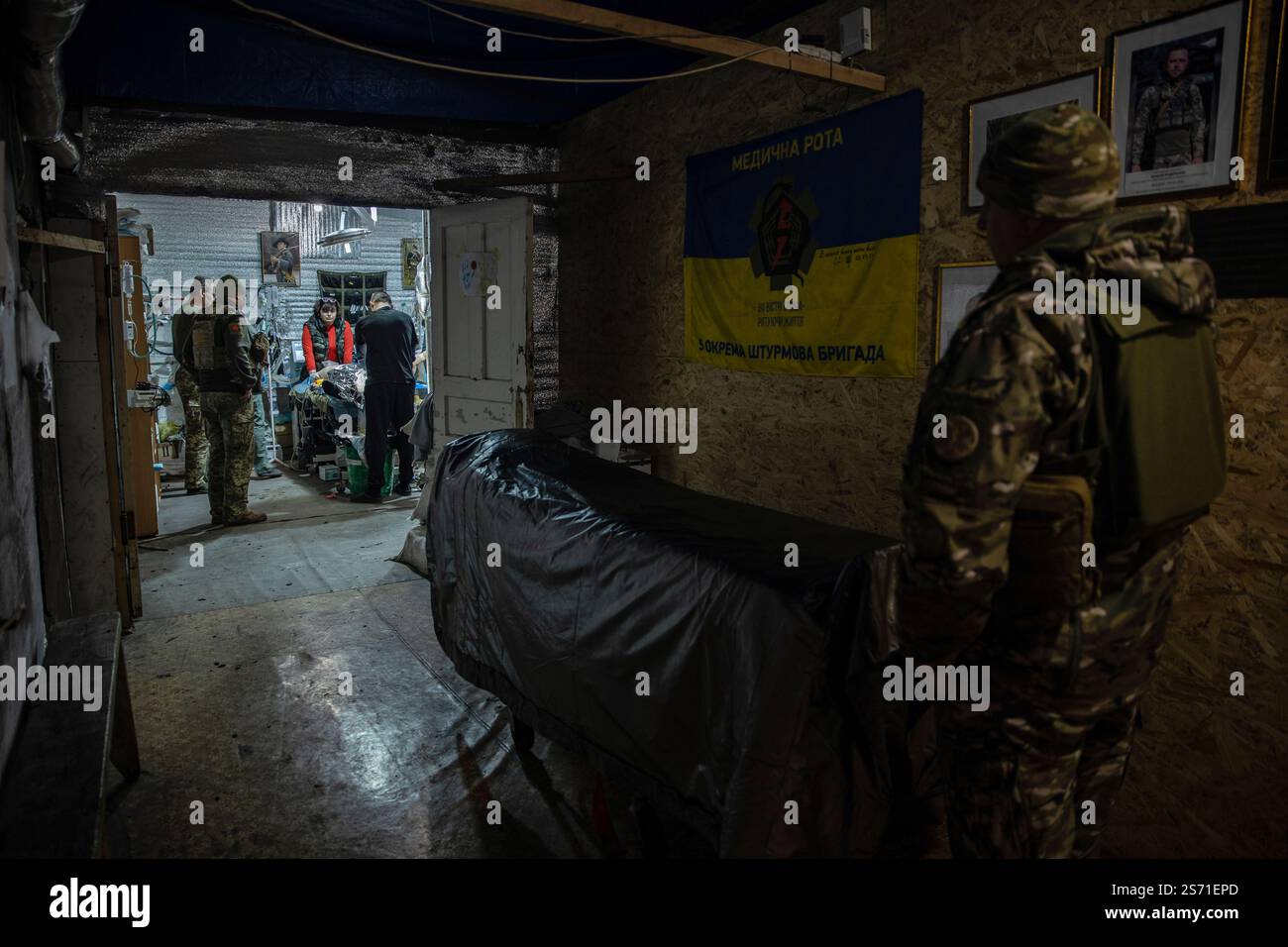 A Ukrainian serviceman waits for the end of a surgery to take away the ...