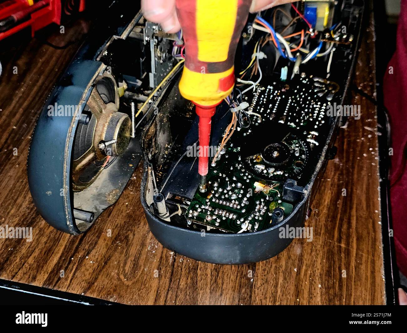 Cairo, Egypt, December 25 2024: An old radio cassette player maintenance, using standard old ...