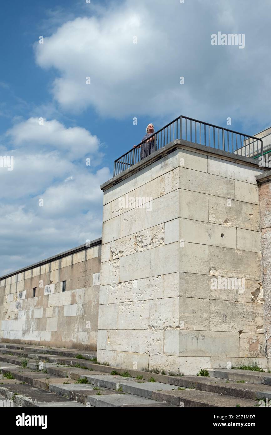 A tourist standing on the "Fuhrer's Podium". The grandstand at the ...