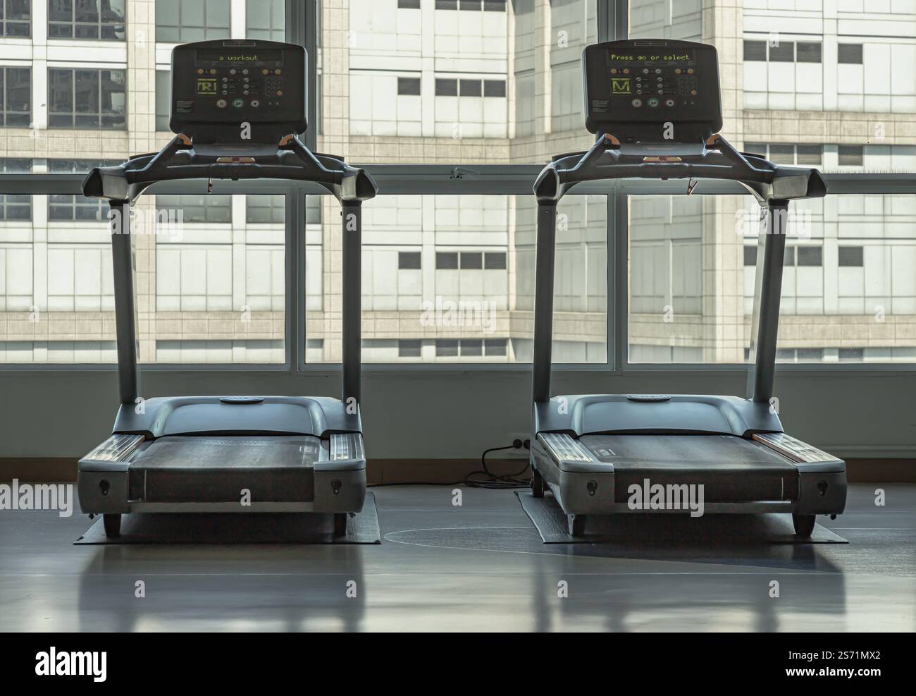 Bangkok, Thailand - Jan 18, 2025 - Back view of Two treadmill machines ...