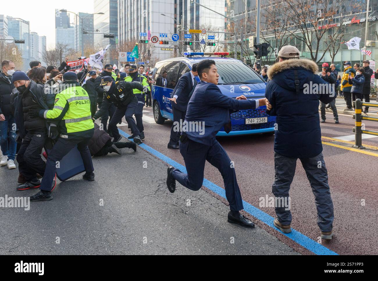 Presidential bodyguards and police are seen pushing supporters of the ...