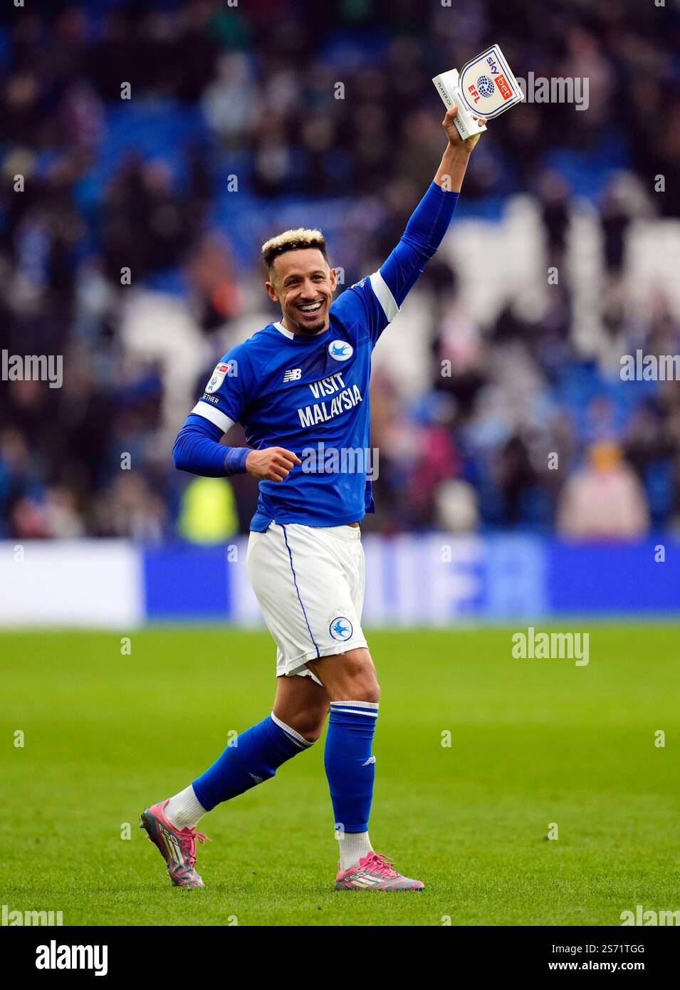 Cardiff City's Callum Robinson with the player of the match award ...