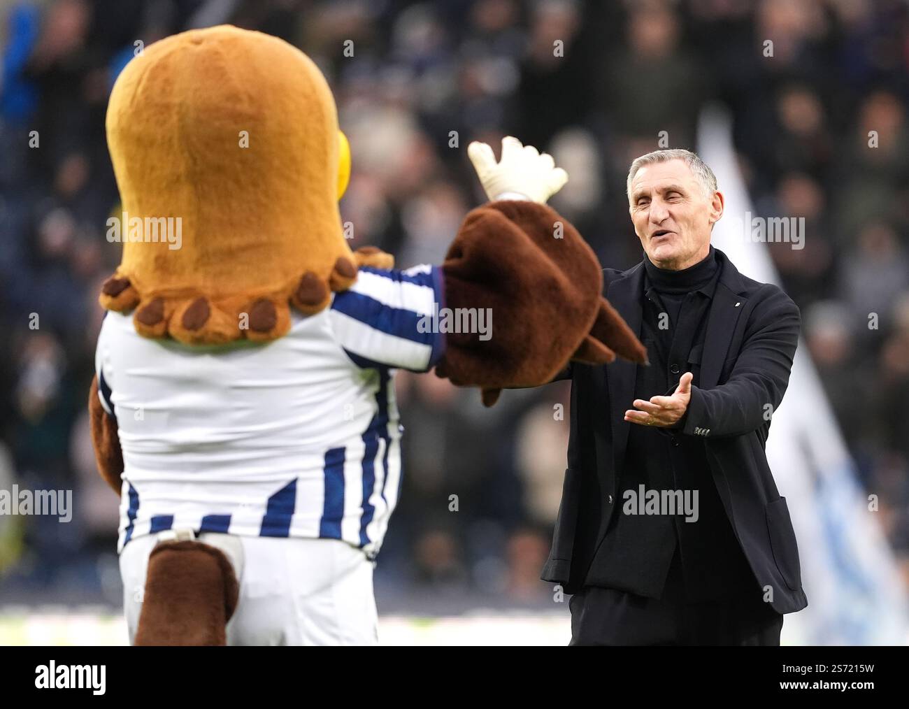 West Bromwich Albion manager Tony Mowbray greets mascot Baggie Bird ...