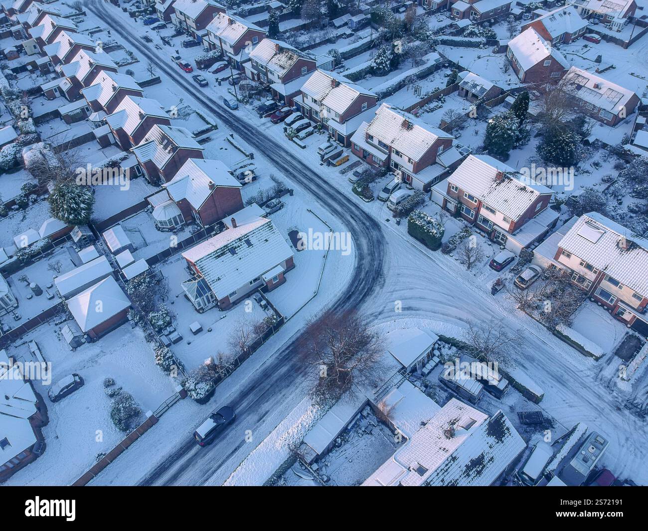 An aerial shot of the treacherous snow covered suburban back streets of ...