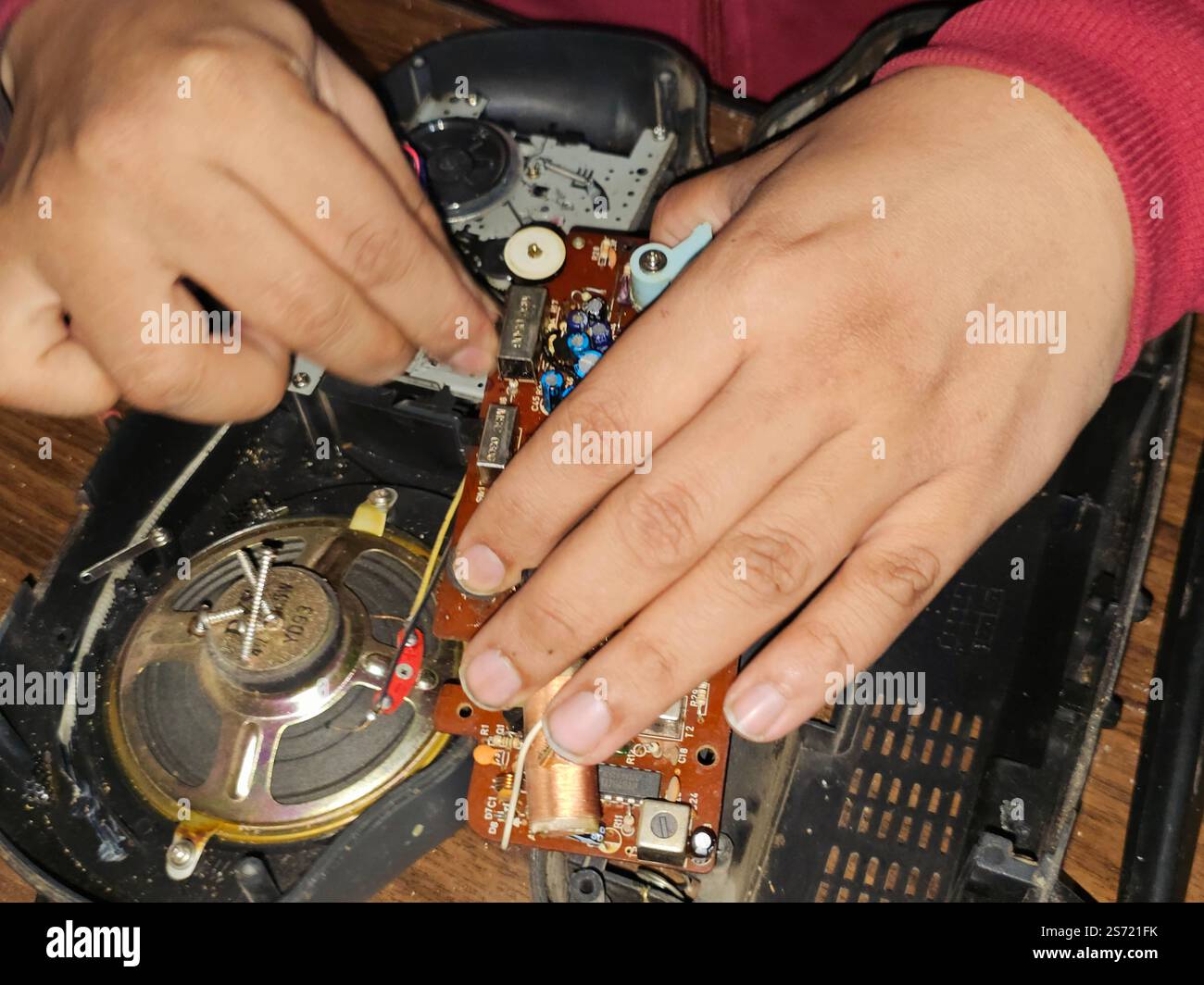 Cairo, Egypt, December 25 2024: An old radio cassette player maintenance, using standard old ...