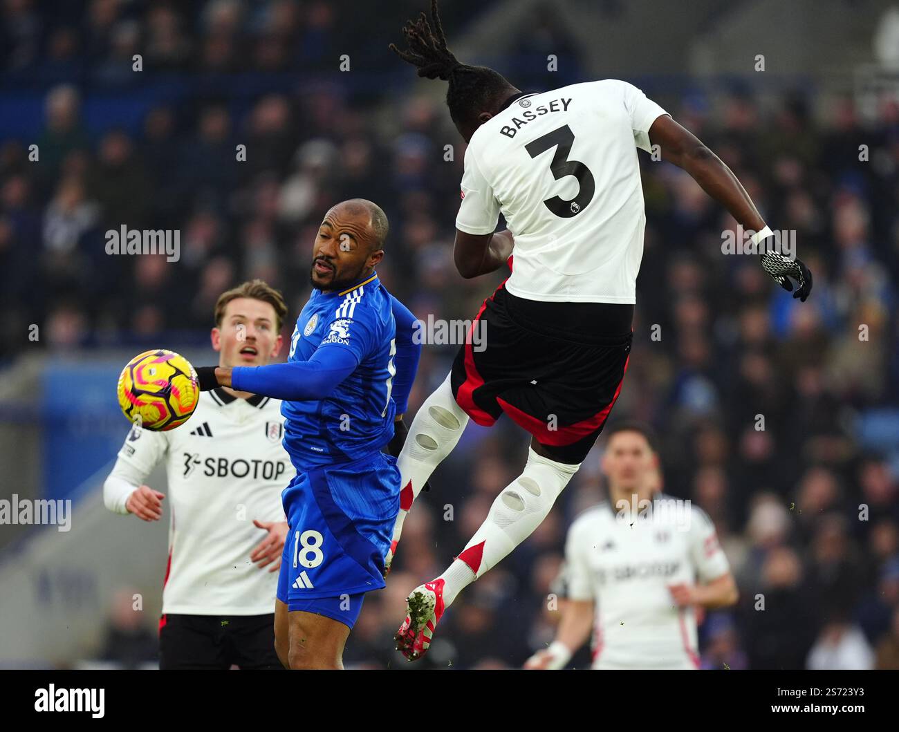 Leicester City's Jordan Ayew and Fulham's Calvin Bassey (right) battle ...