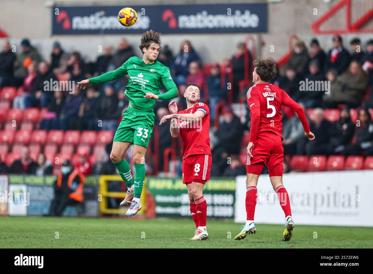 Swindon, UK. 18th Jan 2025. #33, Aaron Pressley of Barrow AFC gets his ...