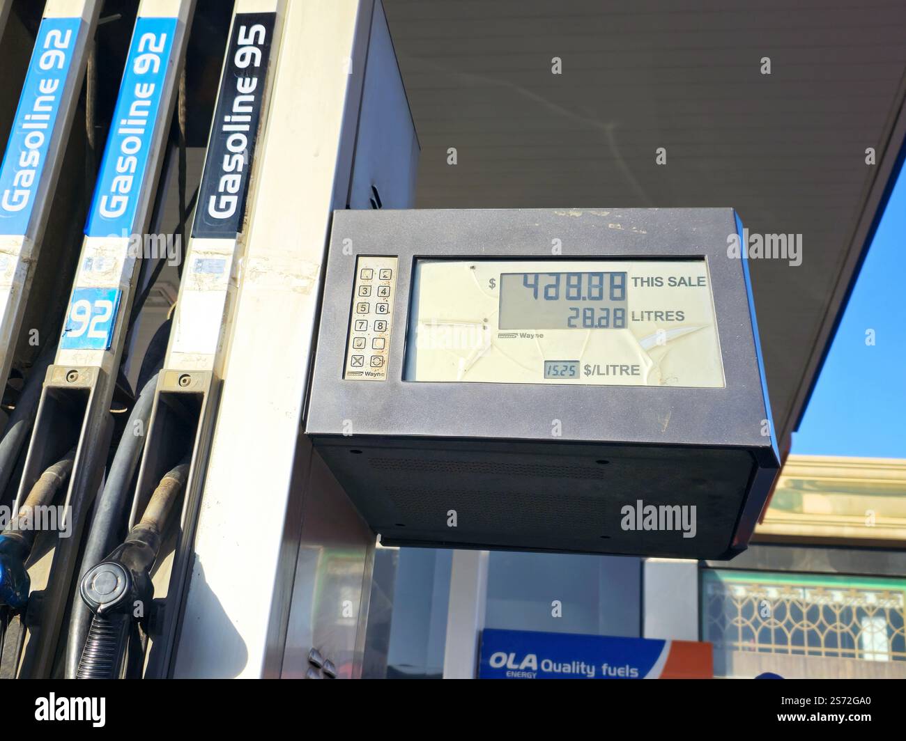 Cairo, Egypt, December 3 2024: OLA gas service station with filling gun ...
