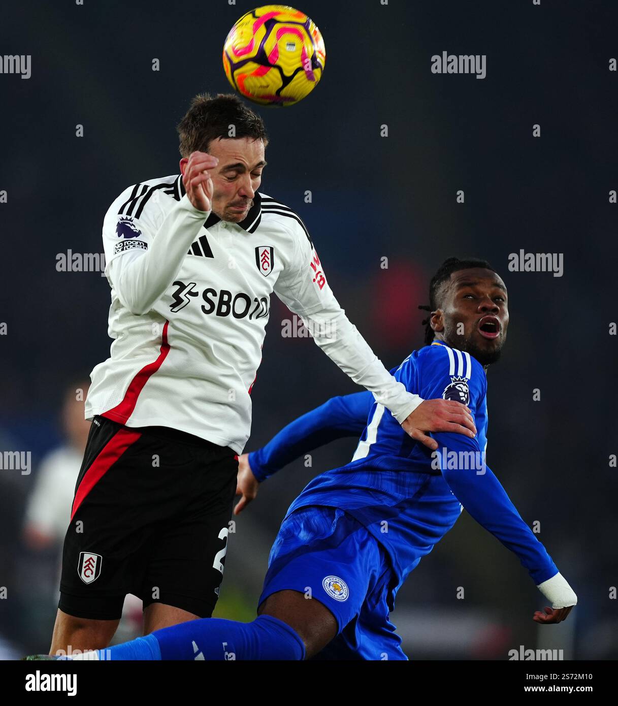 Fulham's Timothy Castagne wins a header against Leicester City's Stephy ...