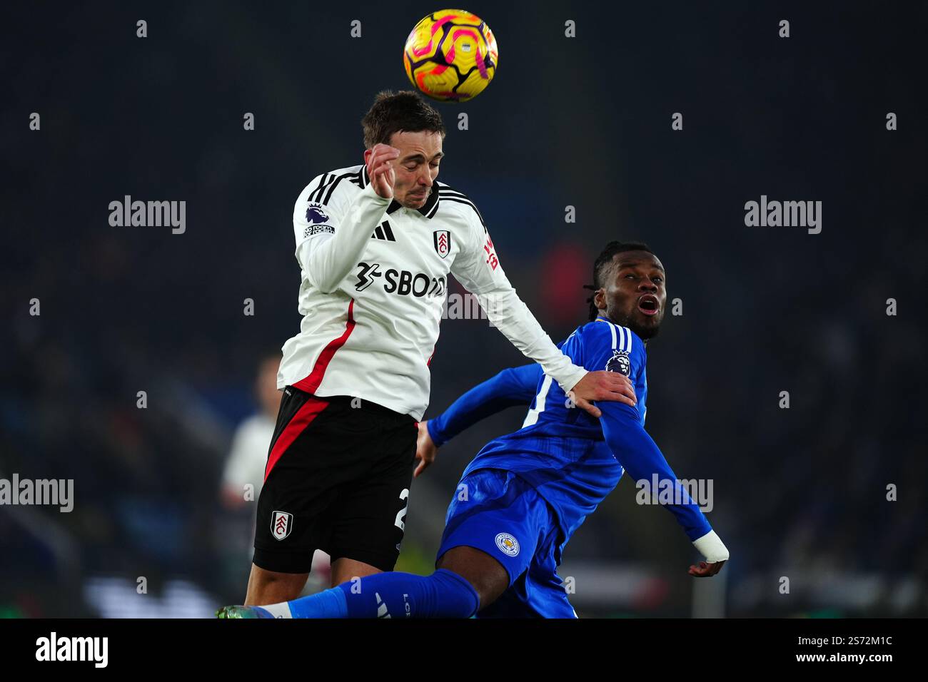 Fulham's Timothy Castagne wins a header against Leicester City's Stephy ...