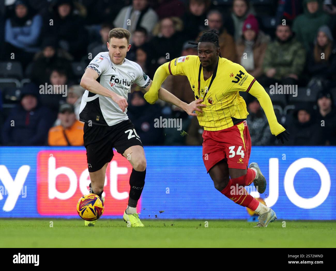 Derby County's Callum Elder (left) and Watford's Kwadwo Baah battle for ...