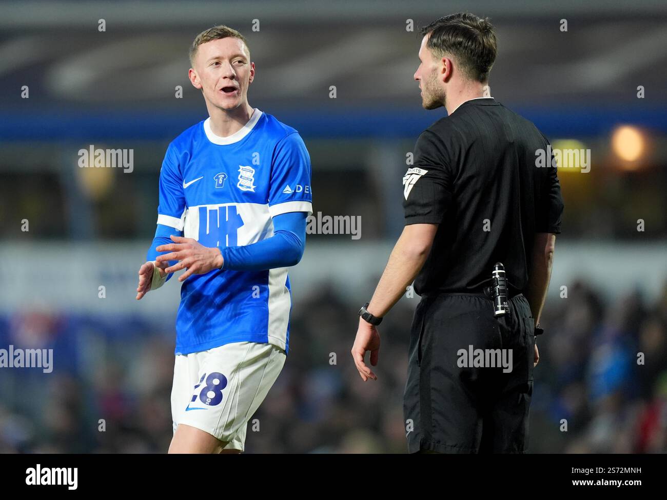 Birmingham City's Jay Stansfield (left) speaks with referee Elliot Bell ...