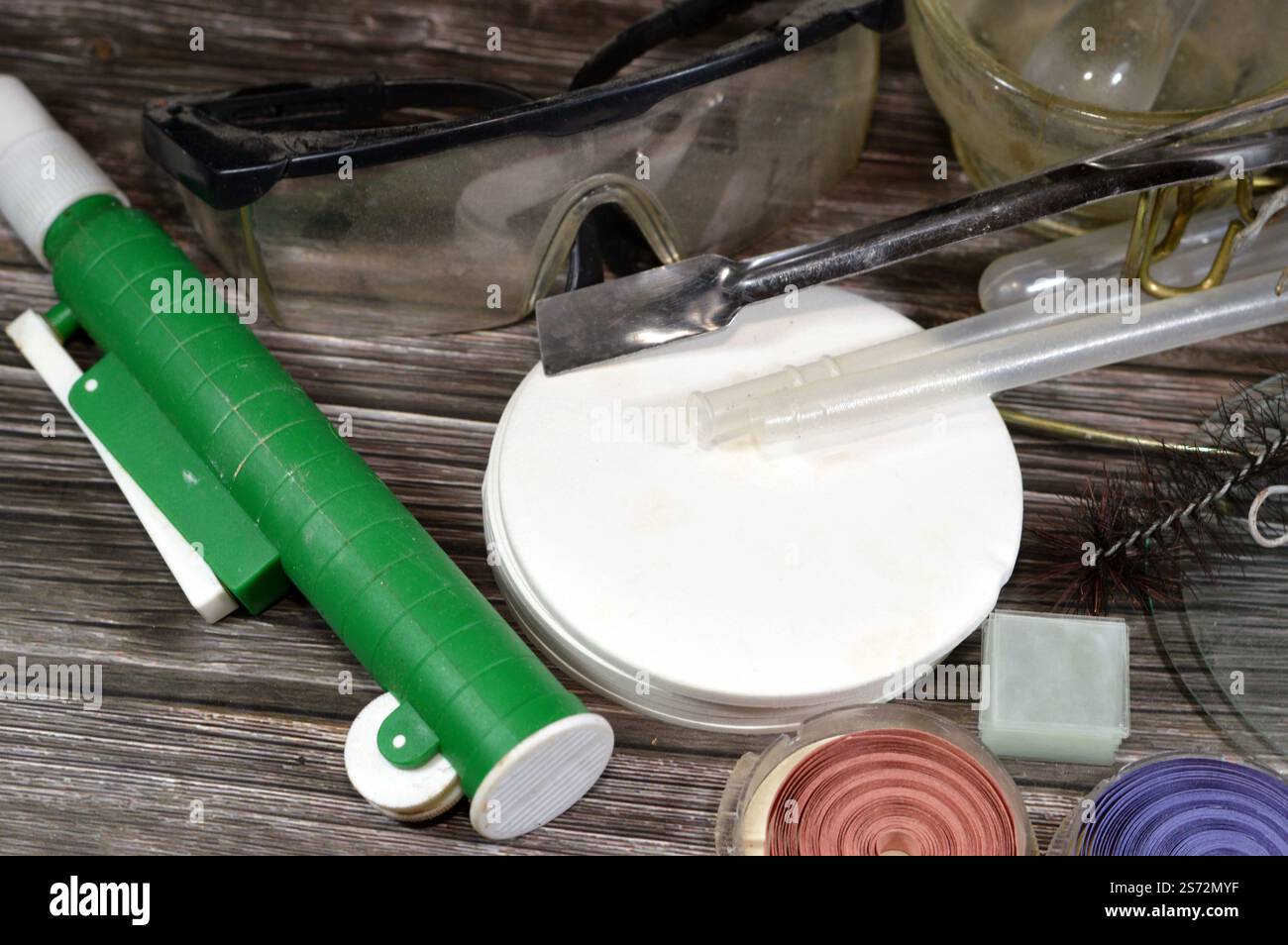laboratory set of different equipment, safety goggles, Litmus papers to ...