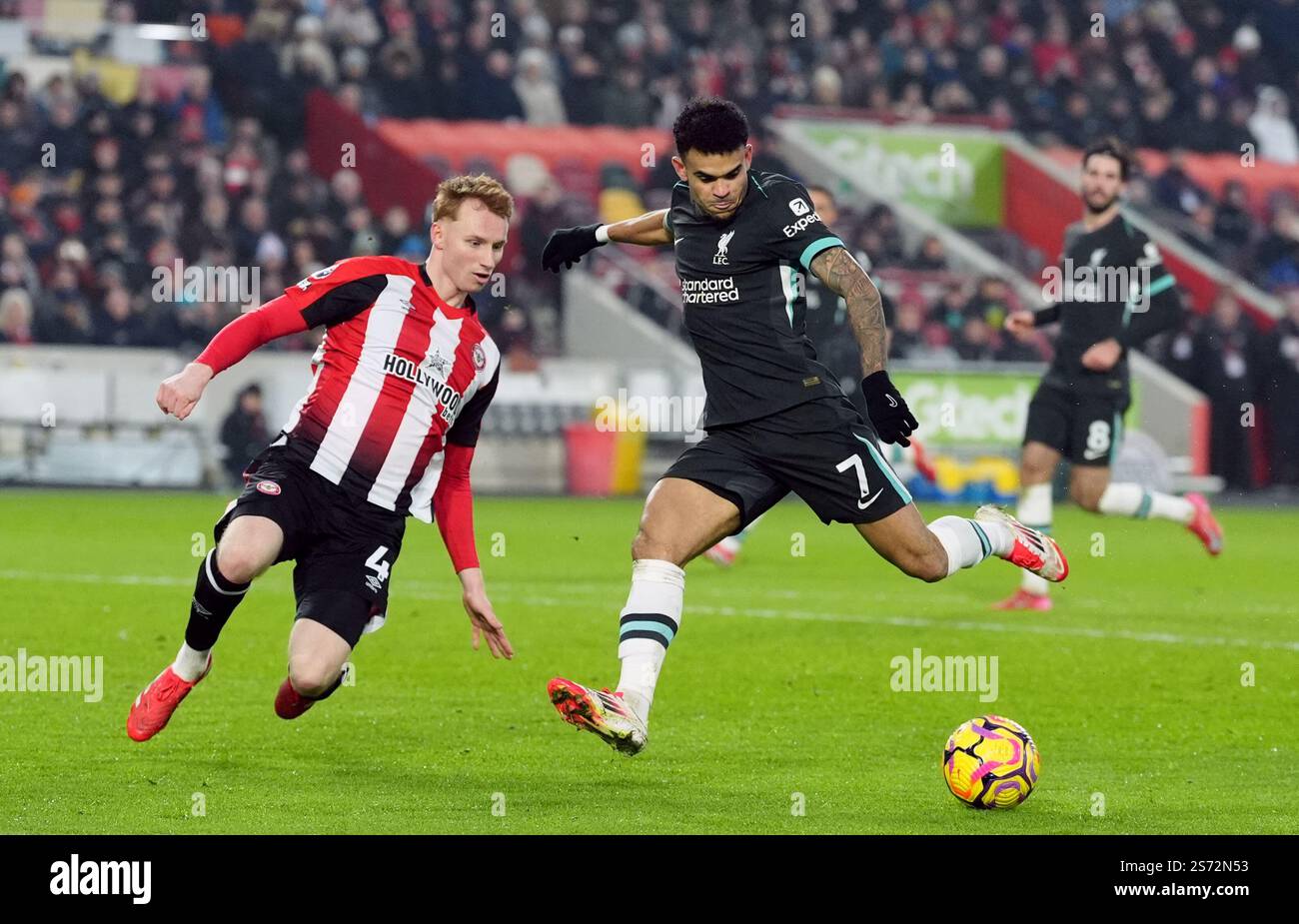 Liverpool's Luis Diaz shoots under pressure from Brentford's Sepp van ...