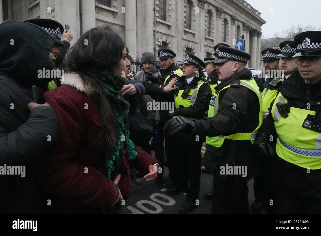 People clash with police officers whilst taking part in a national ...