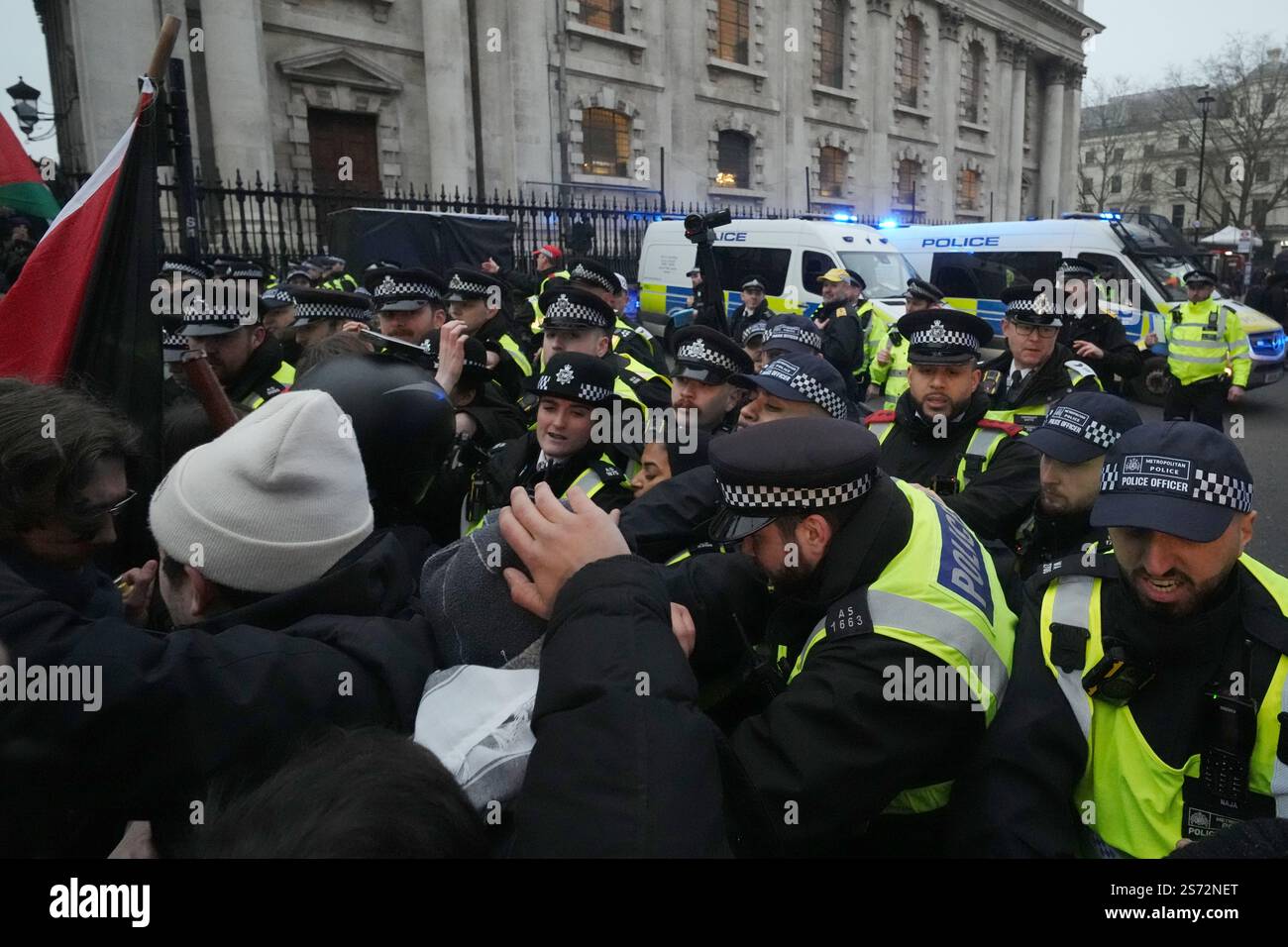 People clash with police officers whilst taking part in a national ...