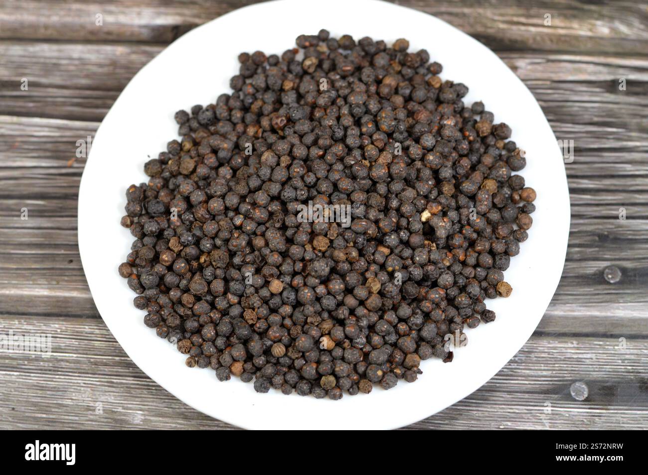 Black pepper (Piper nigrum), a flowering vine in the family Piperaceae ...