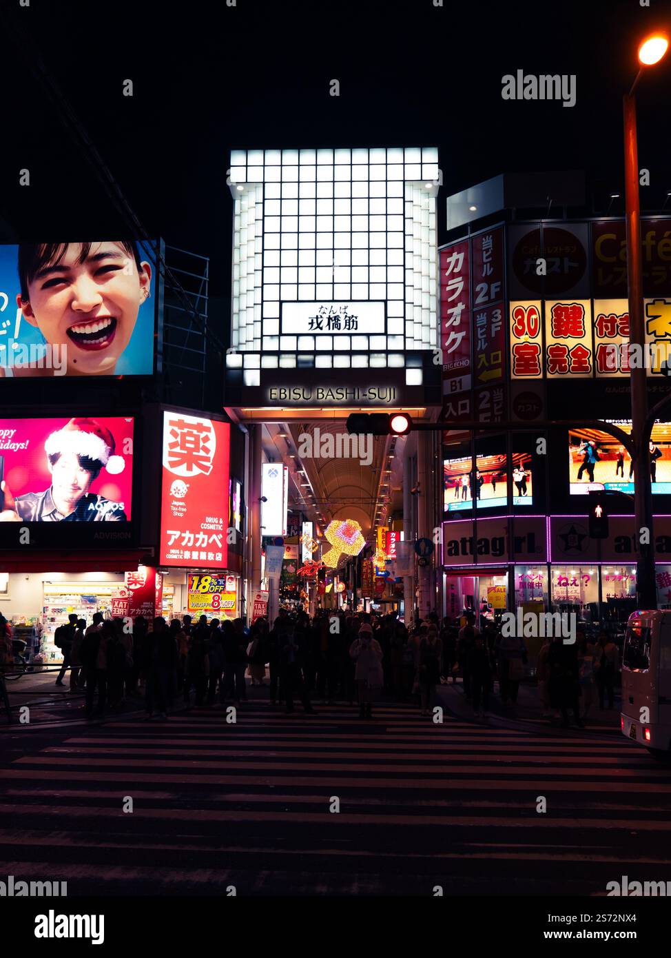 A vibrant night scene in Osaka's Dotonbori district, illuminated by ...