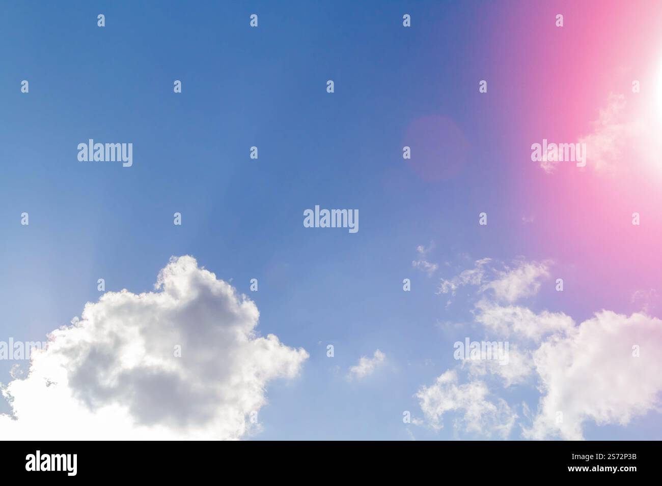 White airy beautiful clouds in a bright blue sky. Clear sunny weather ...