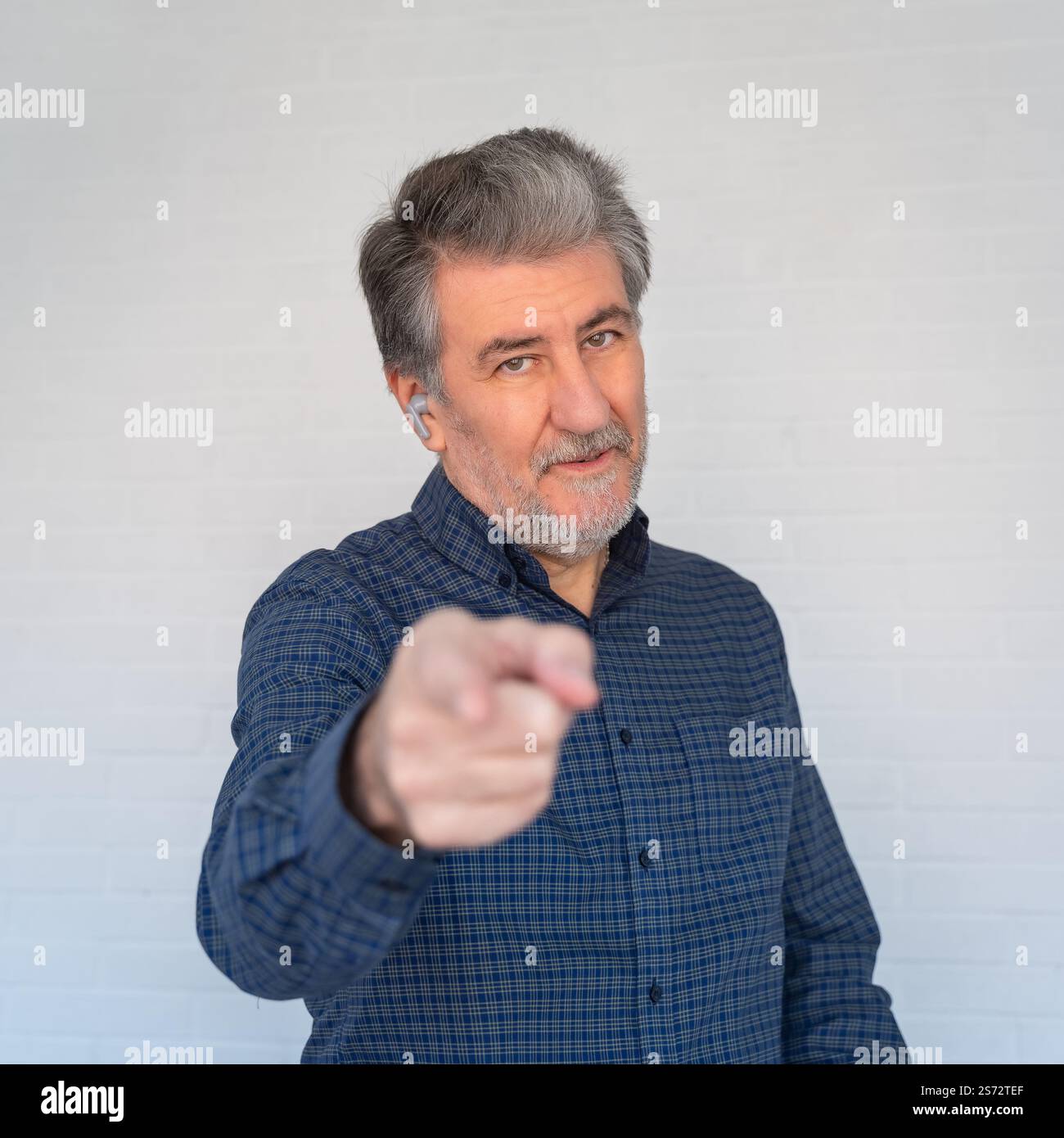 Senior white man pointing at camera with index finger with positive ...