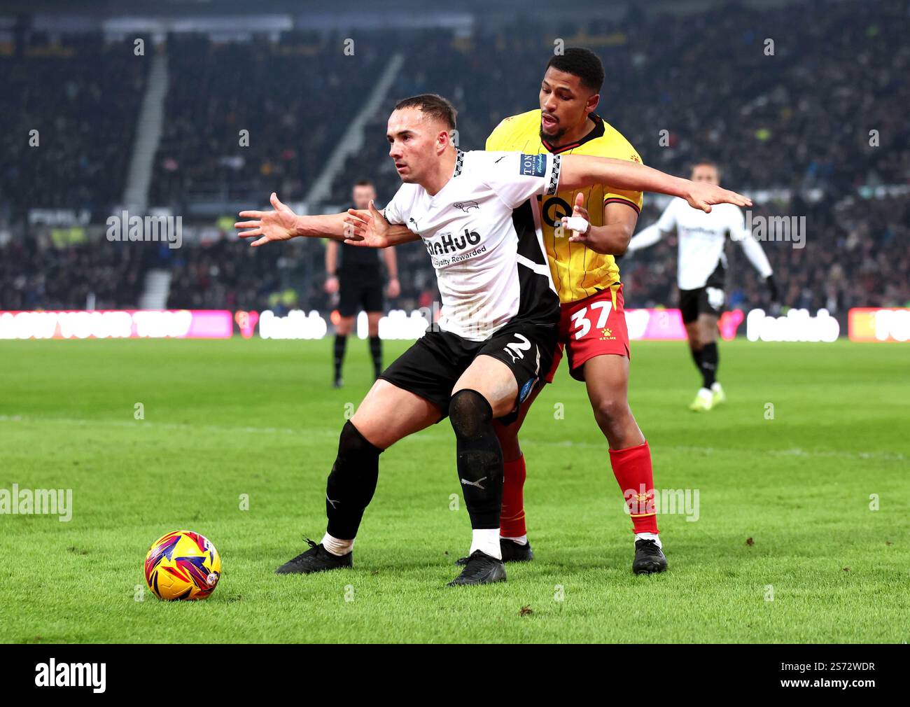 Derby County's Kane Wilson (left) and Watford's Yasser Larouci battle ...