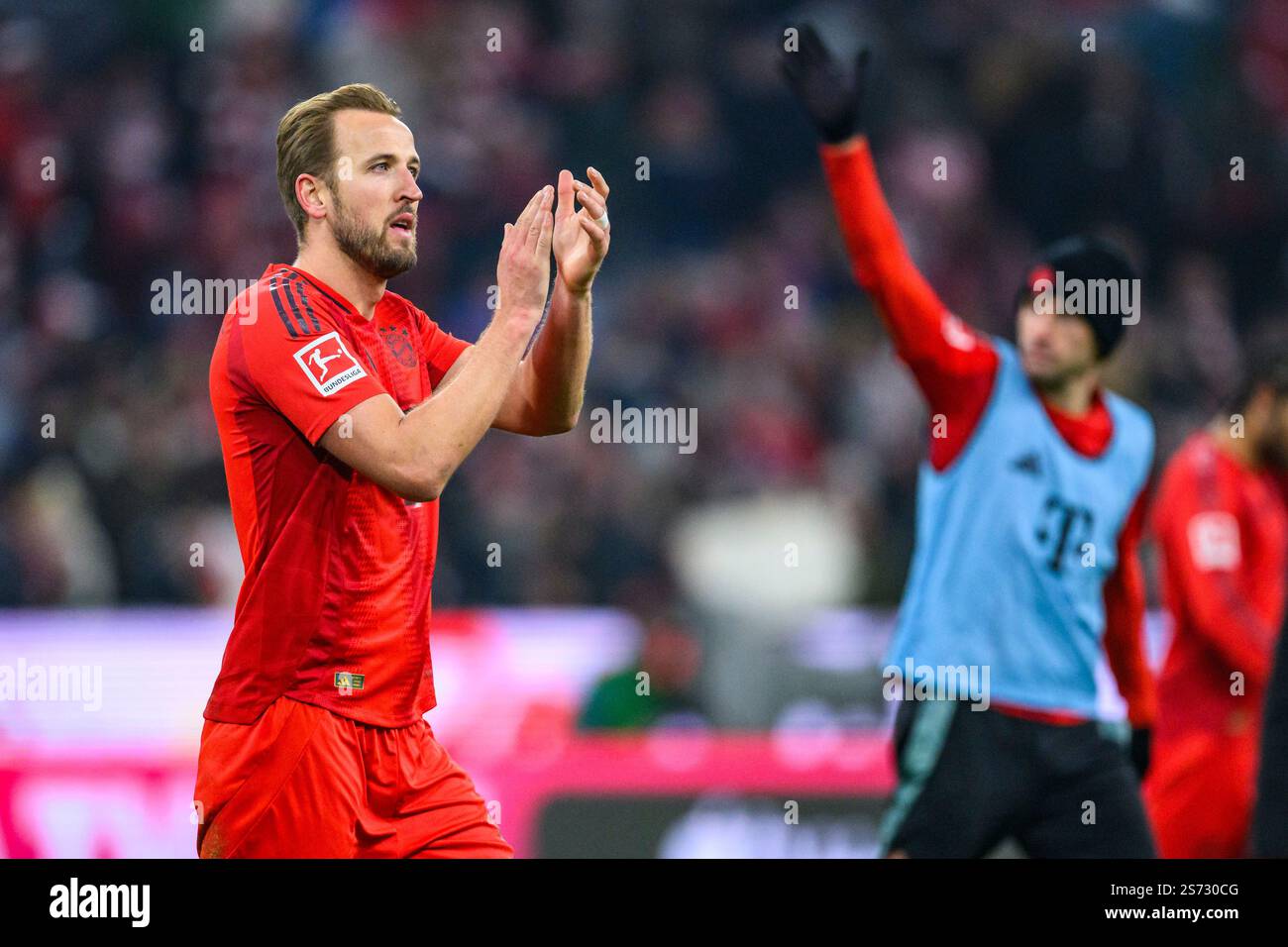 Munich's Harry Kane applauds fans after the German Bundesliga soccer ...